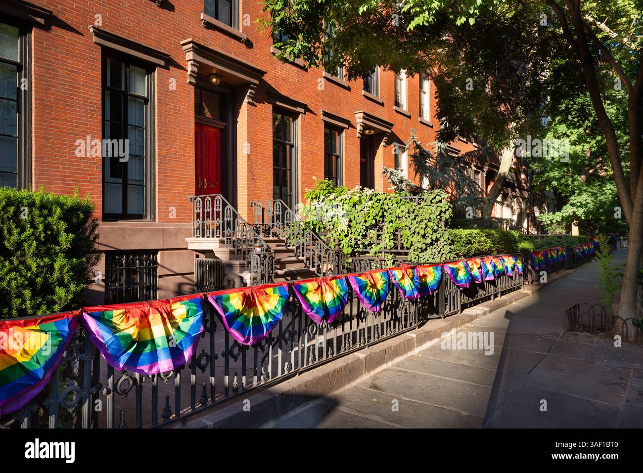 Townhouses in Chelsea Historic District in summer with rainbow flag ...