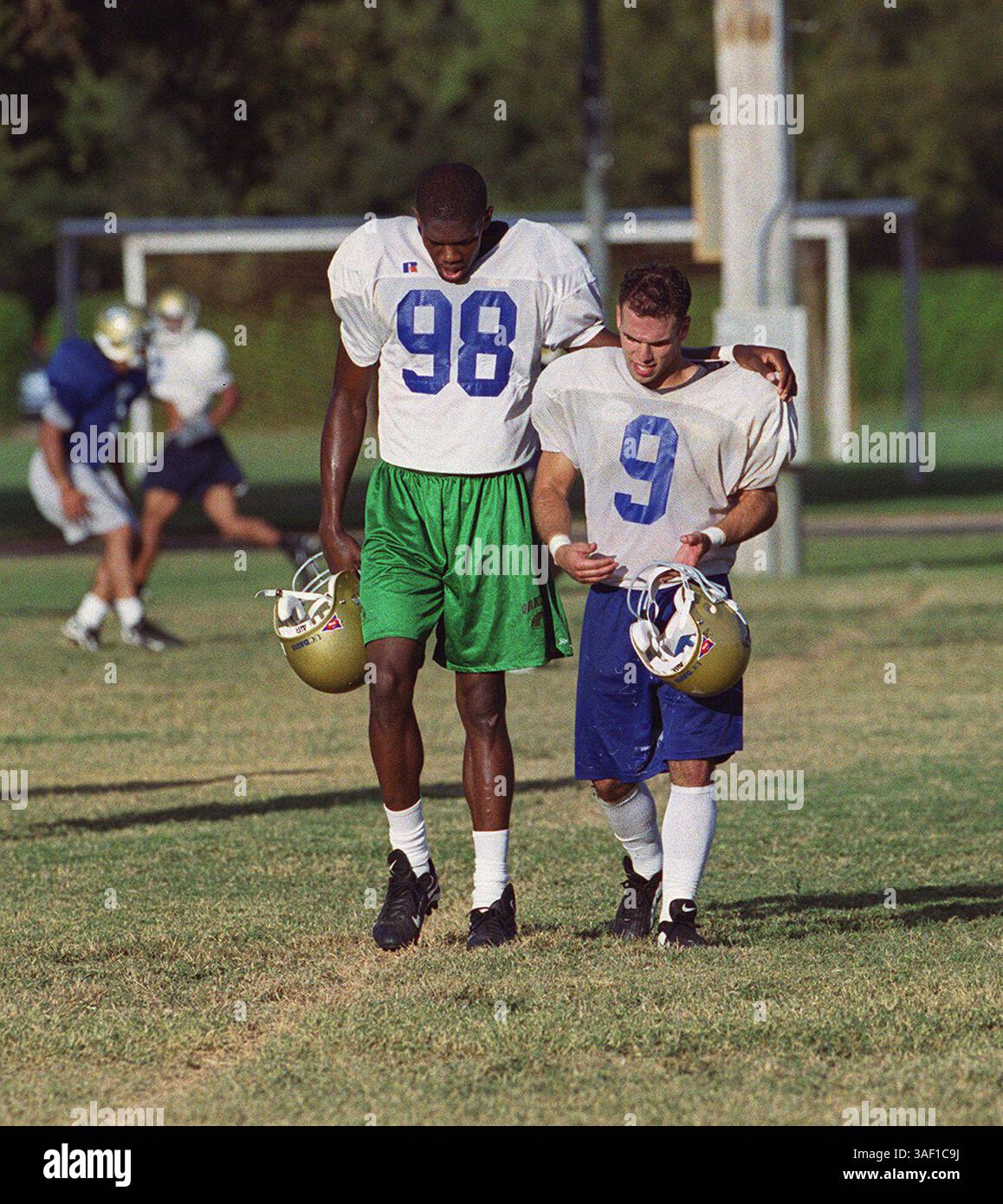 U.C. Davis football players Onome Ojo , left, and Charley Enos right ...