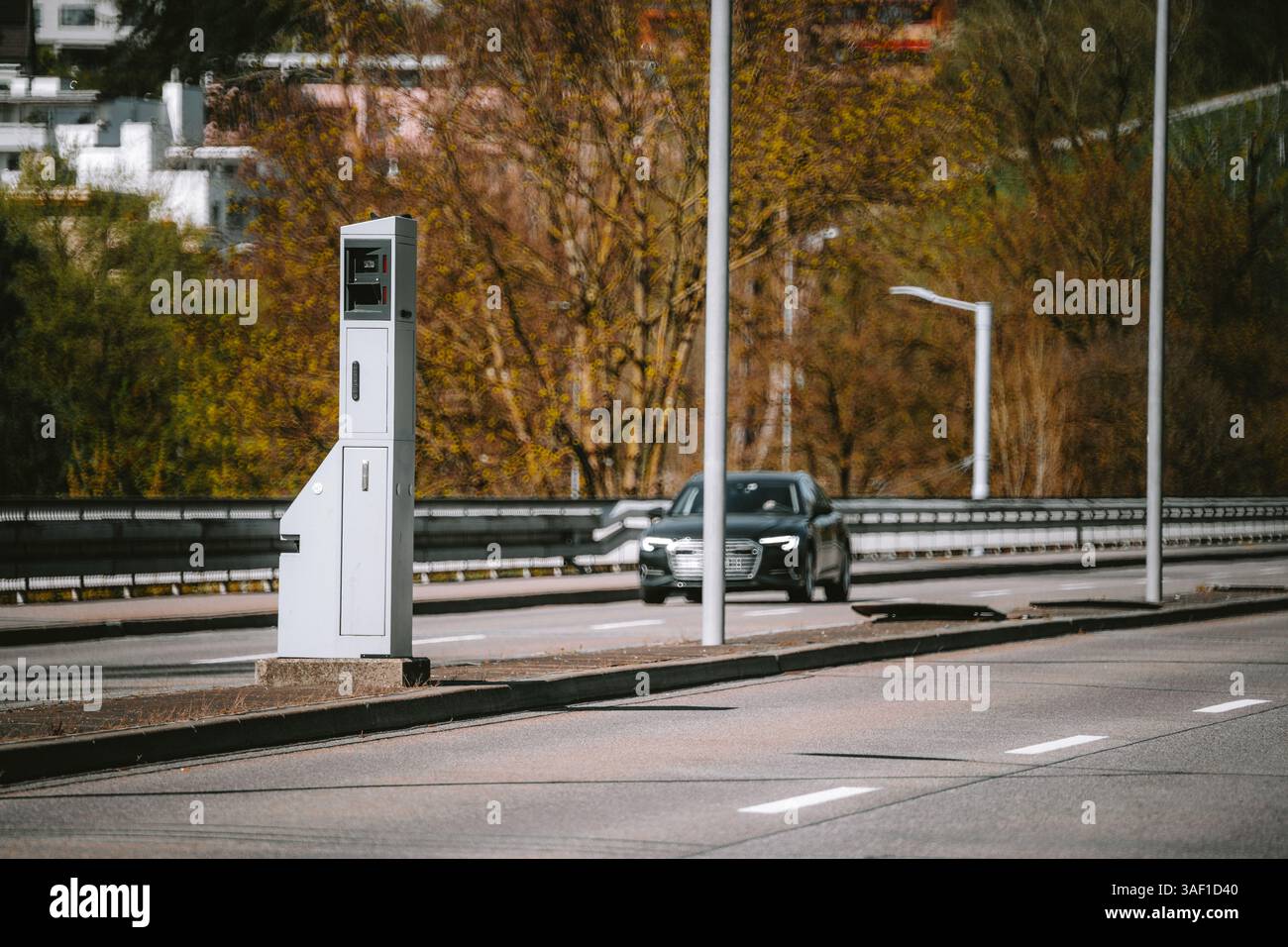 Gray, mobile, car traffic speed trap camera between two car lane. Close ...