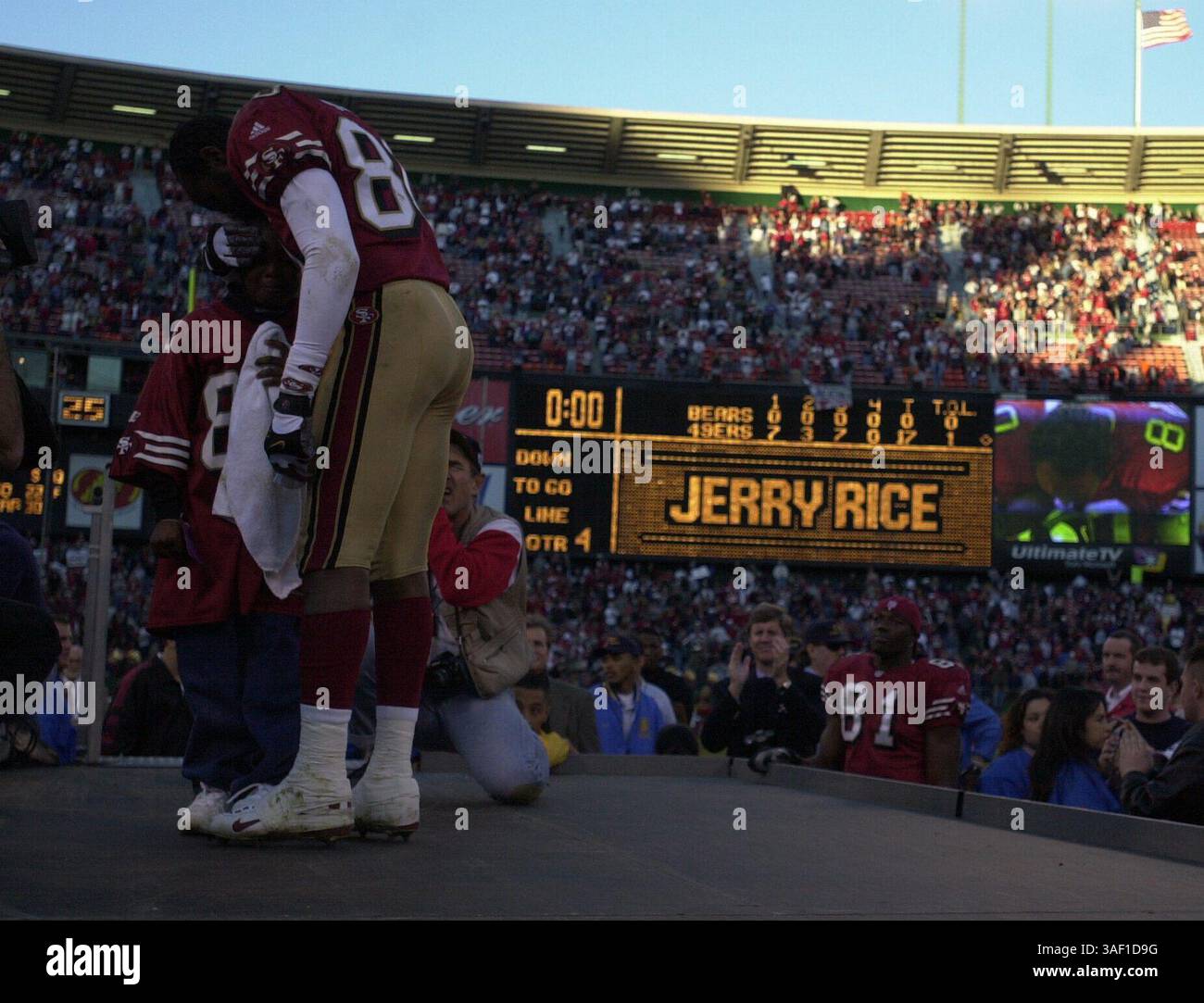 San Francisco 49er Jerry Rice kisses his son Jerry Rice Jr. (age 9) on ...