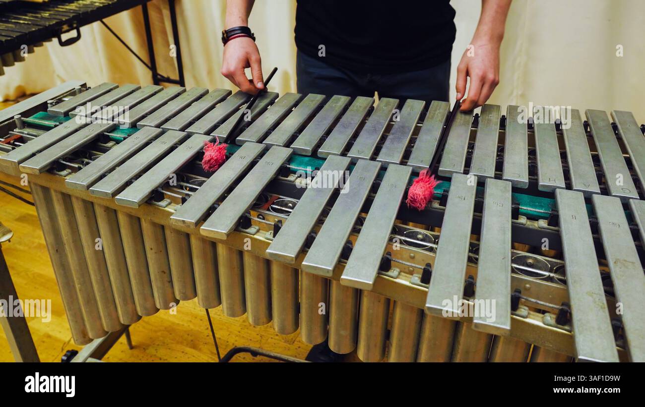 A young guy playing the vibraphone at a music school Stock Photo - Alamy