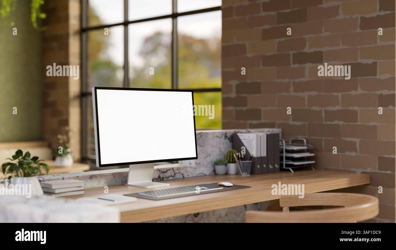 The white screen computer on marble laminate wooden working desk in an ...