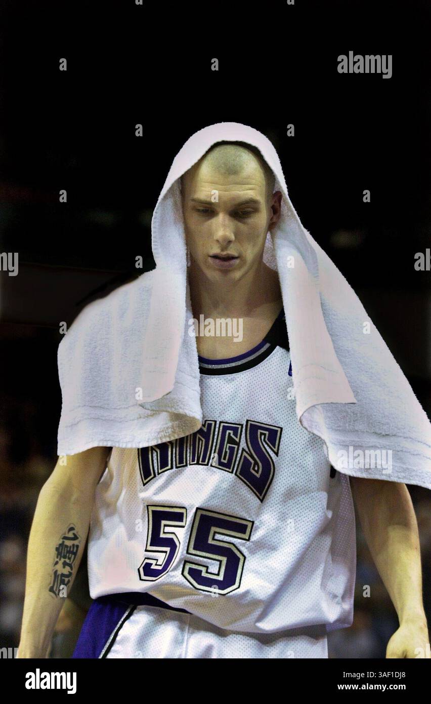 King guard Jason Williams, shrouded by a towel, heads back to the bench ...