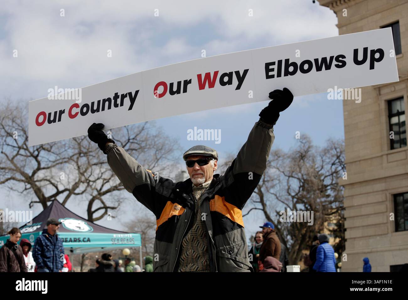 A man seen holding a placard during a rally against U.S tarrifs and ...