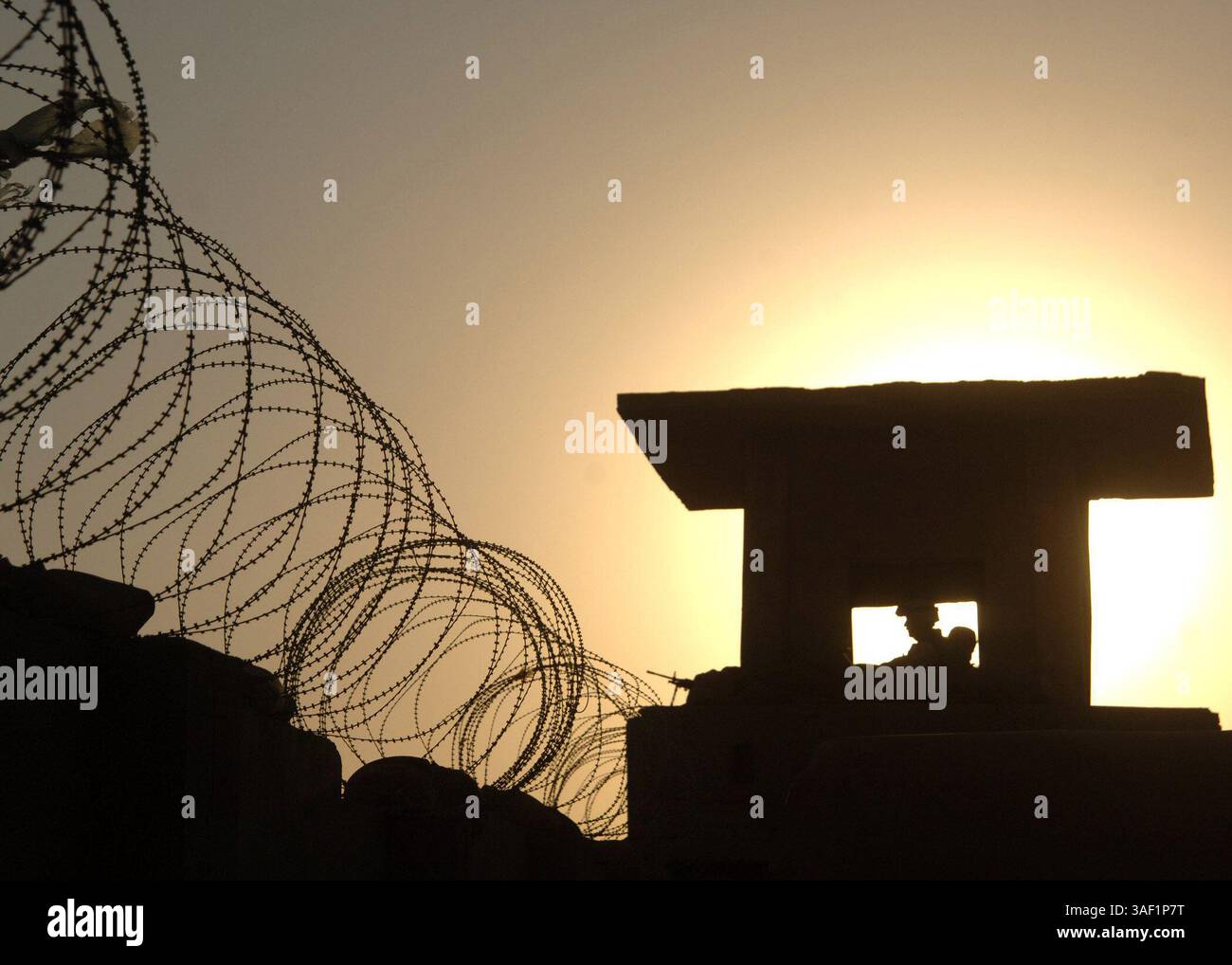 Jul 01, 2005; F.O.B. Hieder, Ninewa, Iraq; The hot sun silhouettes Army ...