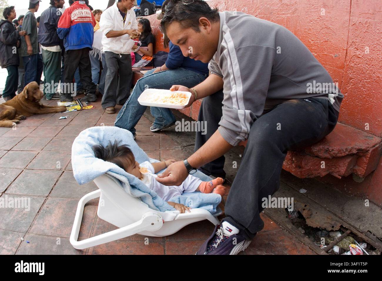 Sep 15, 2005; Mexico City, MEXICO; IVAN feeds his daughter, SHARENI ...