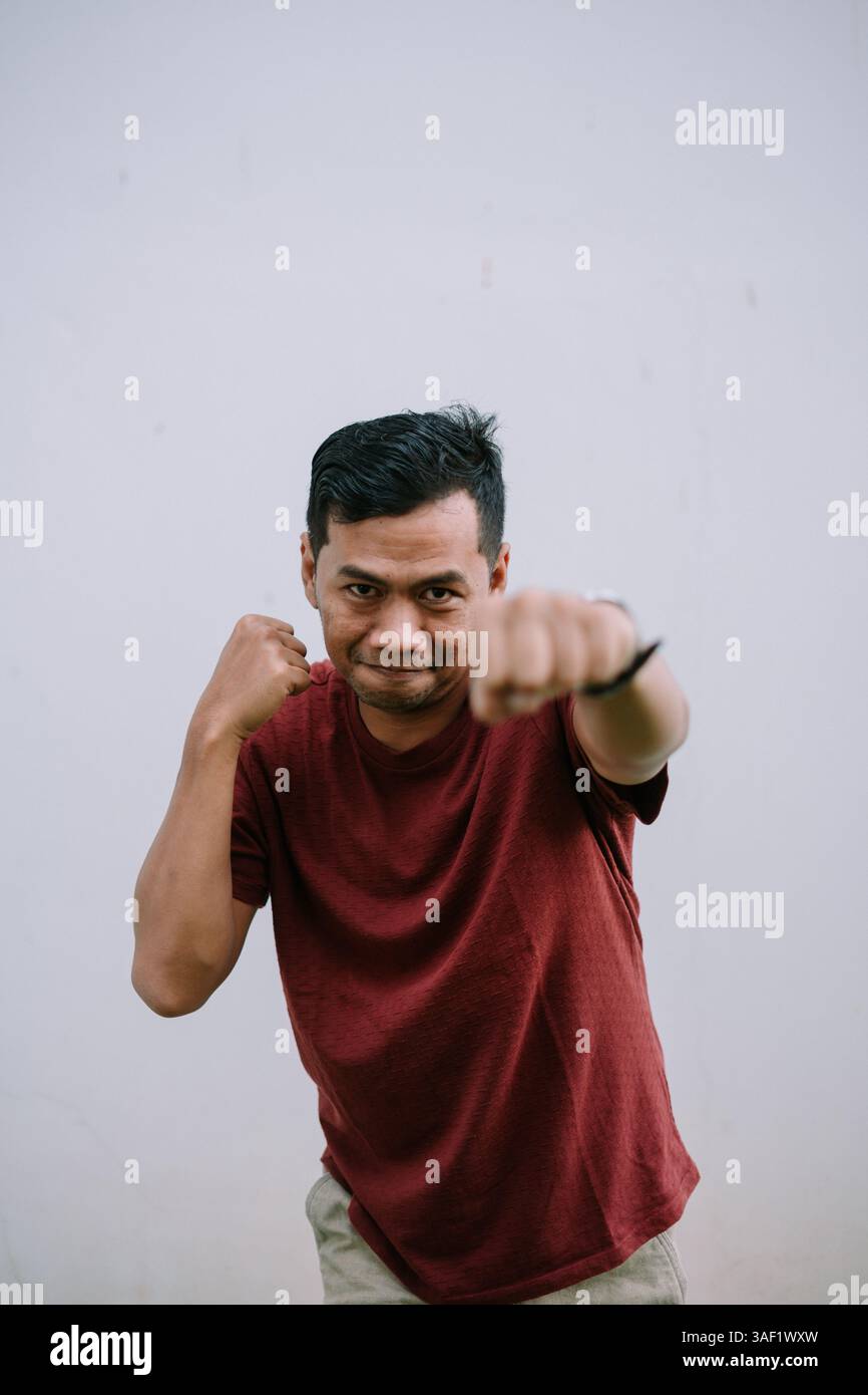 A determined man in a boxing stance, ready for any challenge ...