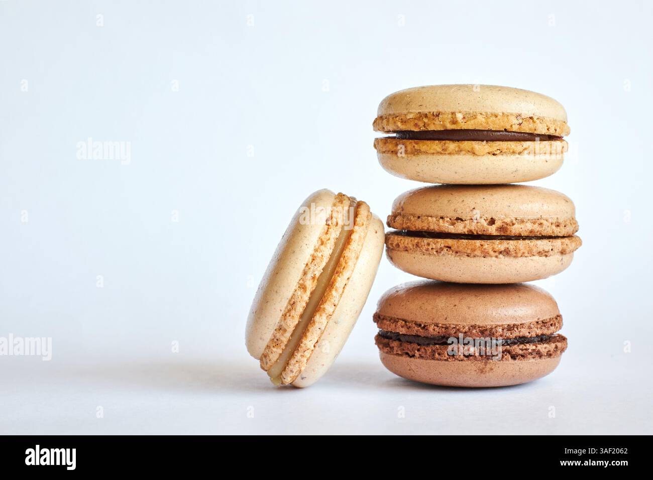 different shades of brown macaron stack on gray background Stock Photo ...