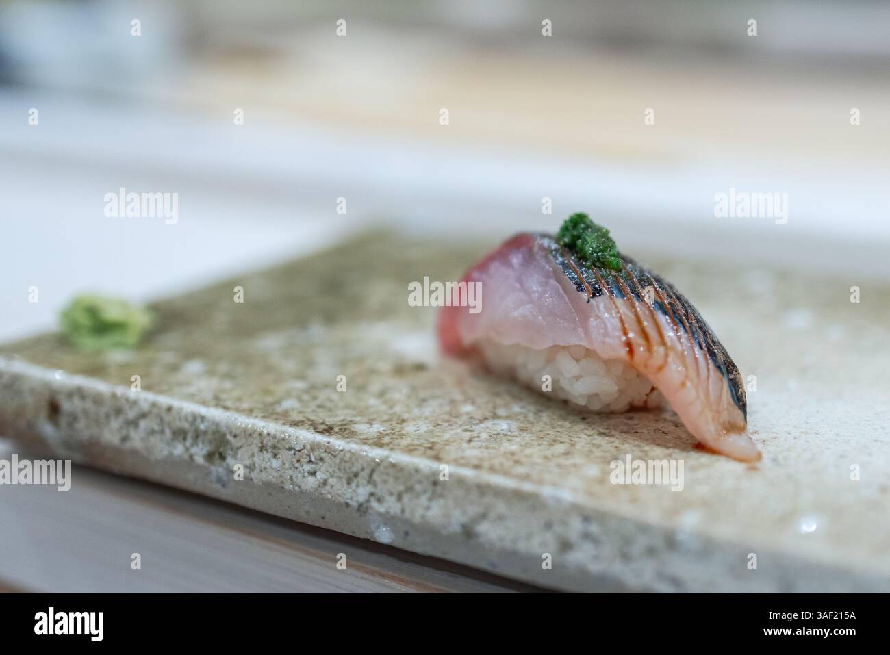 Japanese jack mackerel nigiri sushi highlights its glossy surface and ...