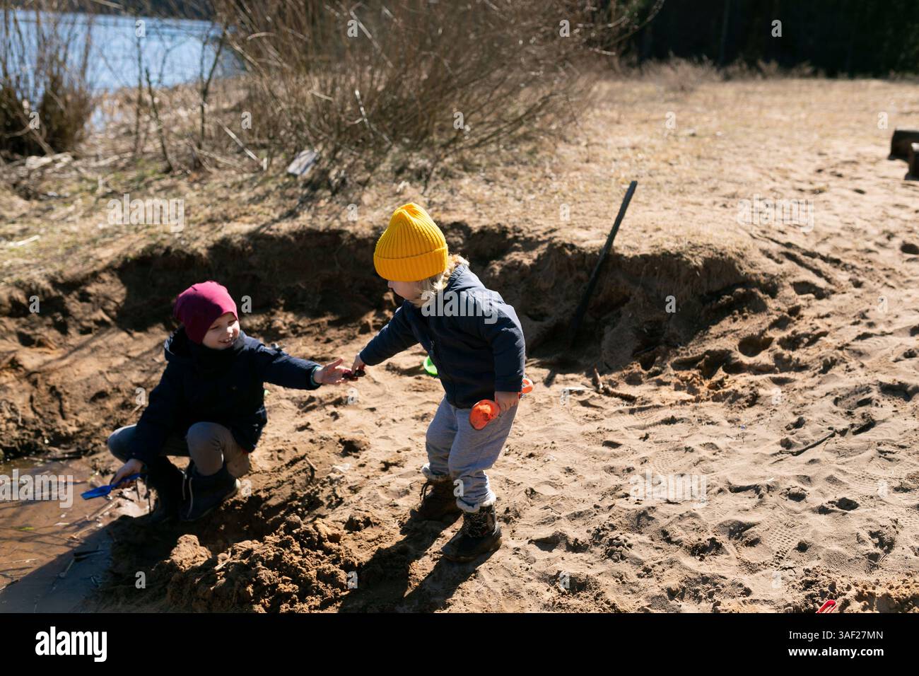 Children play sandy riverbank hi-res stock photography and images - Alamy