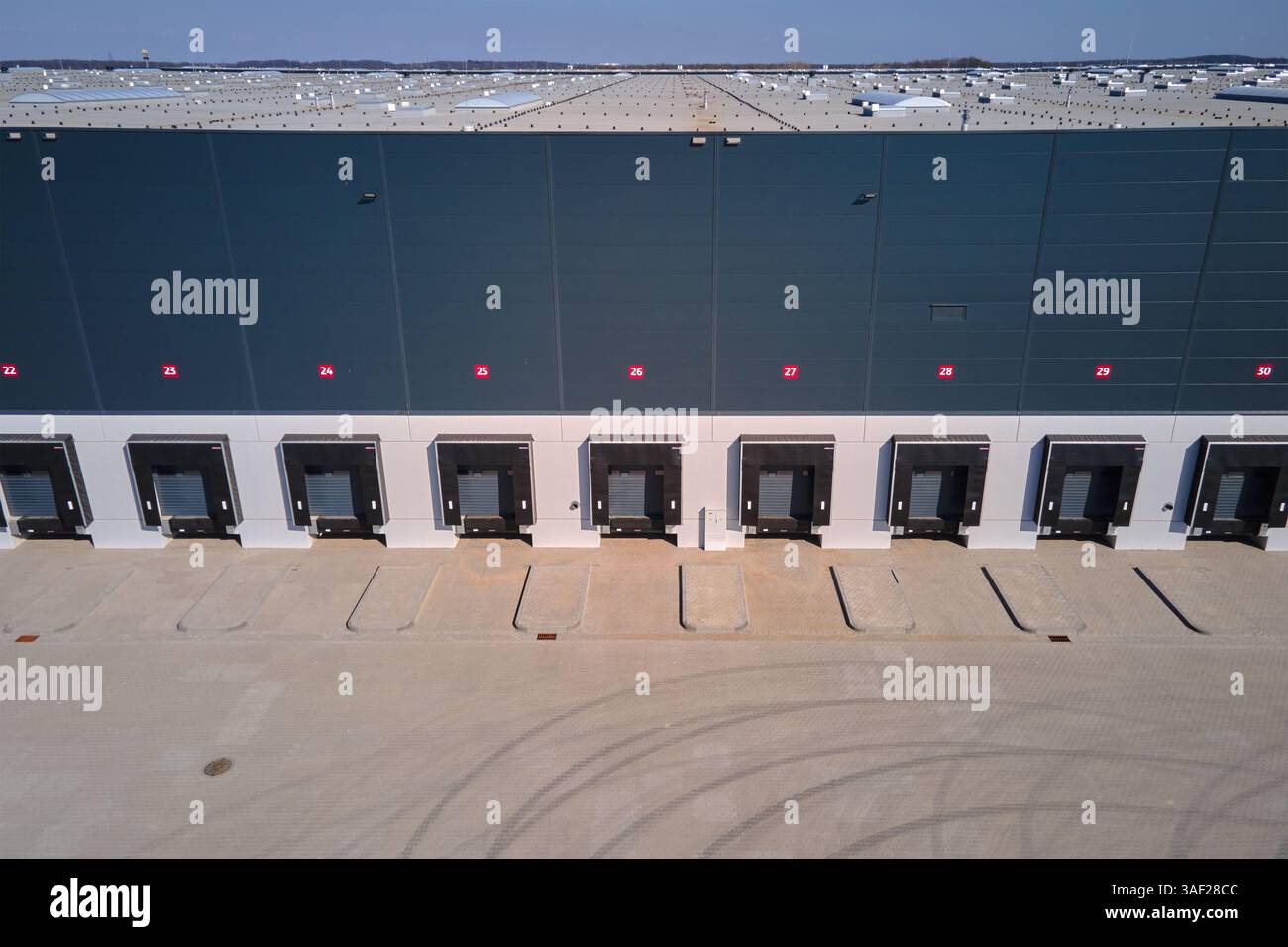 Aerial view of logistics warehouse exterior with loading platforms ...