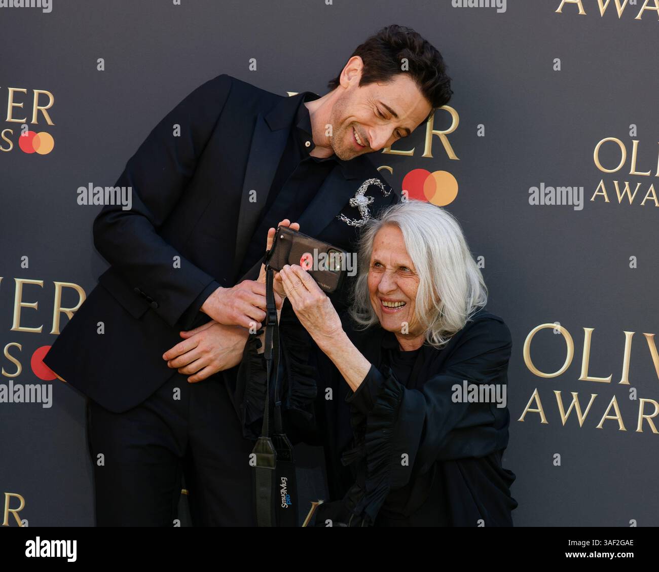 London, UK. 06th Apr, 2025. Adrien Brody and Sylvia Plachy attend the ...