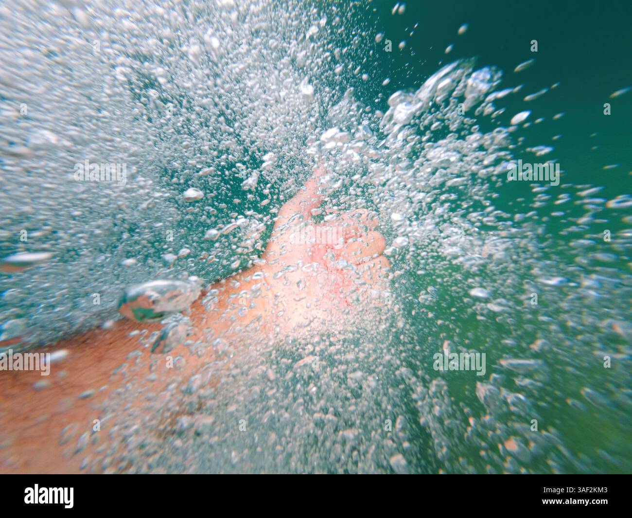 Man gesturing thumbs up underwater in deep sea water as sign of ...
