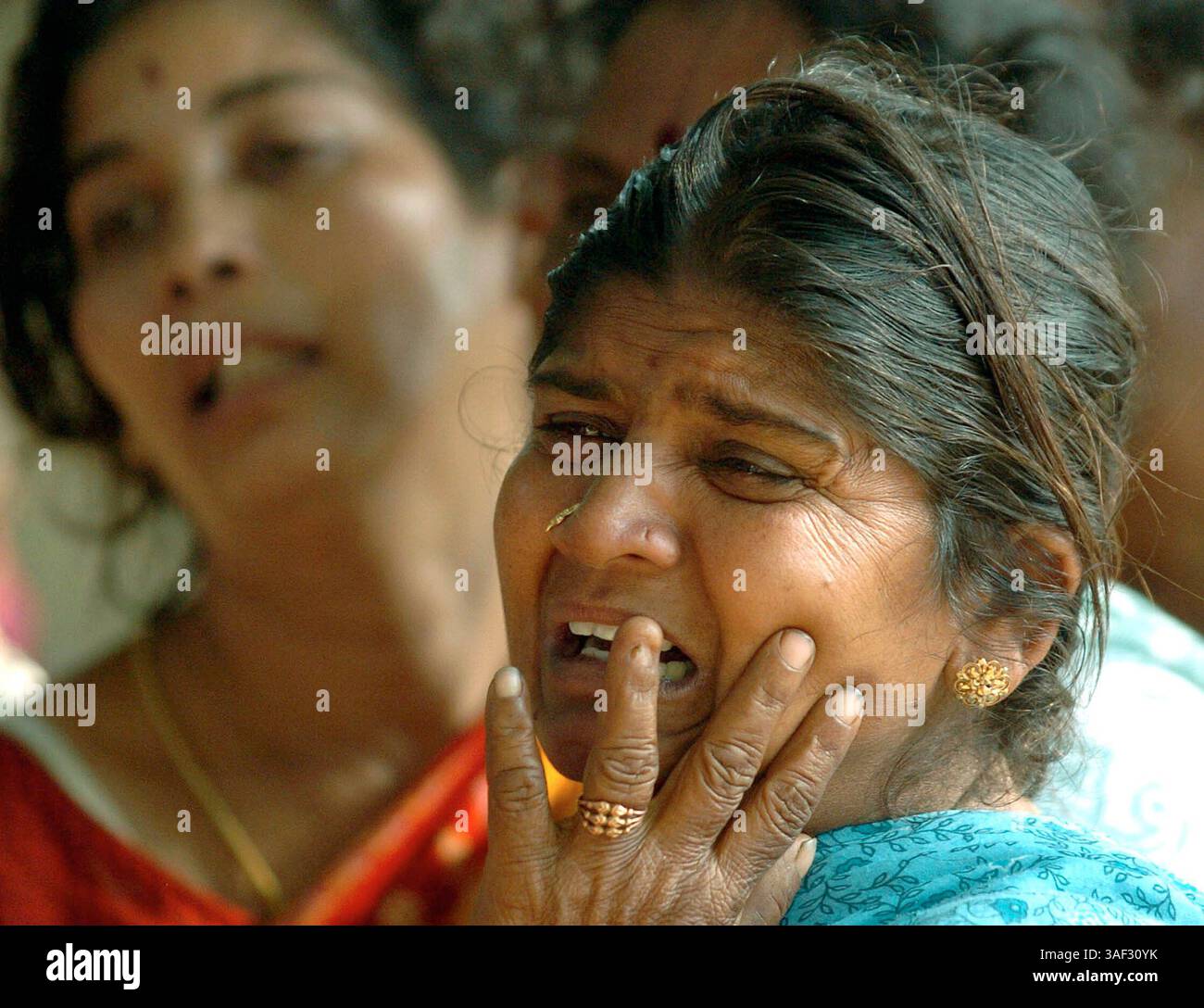 Dec 29, 2004; Cuddalore, INDIA; A tsunami survivor woman weeps in ...