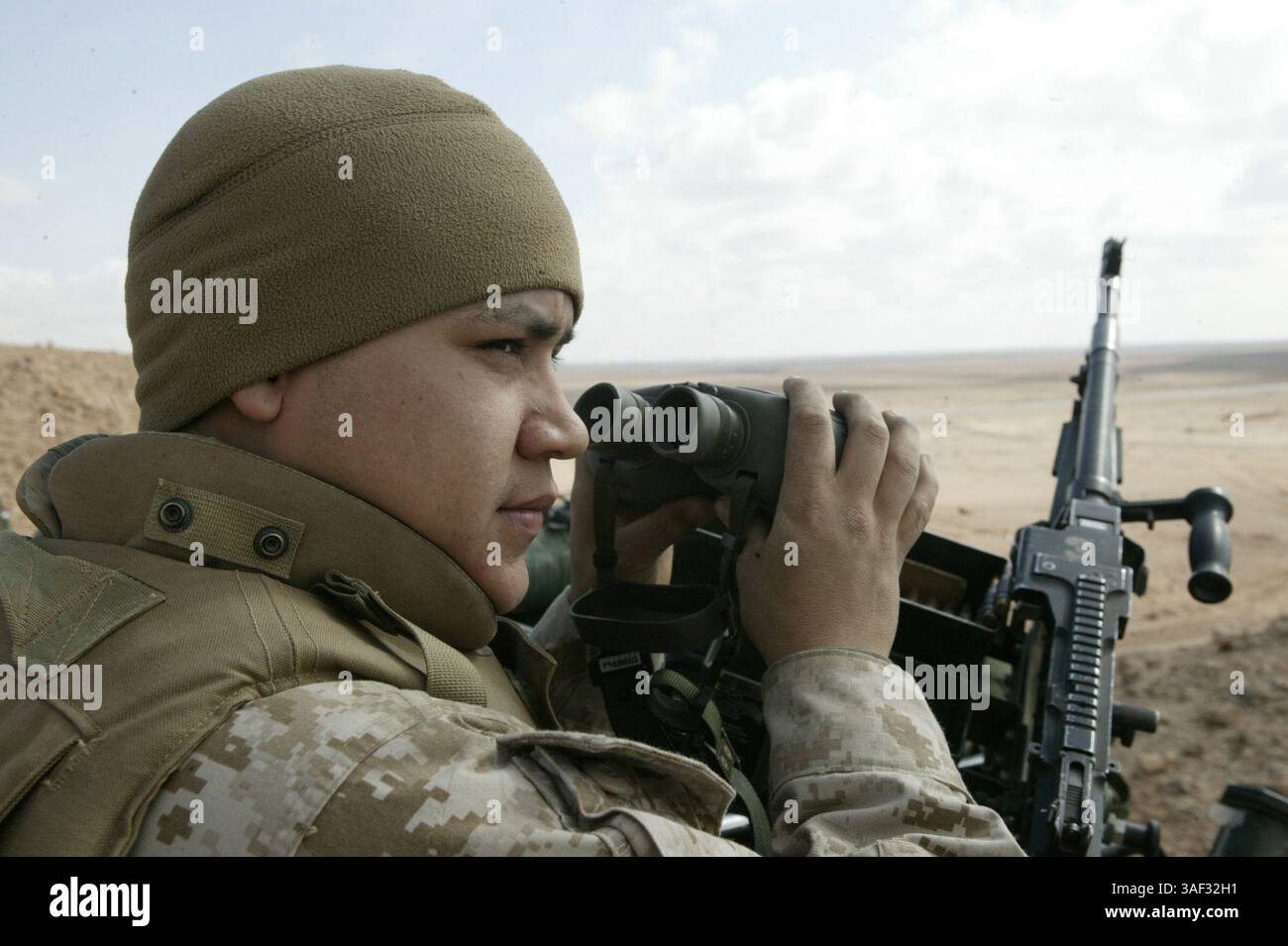 Feb 12, 2005; Camp Haditha Dam, Iraq; Lance Cpl. GUILLERMO MUNOZ, a ...