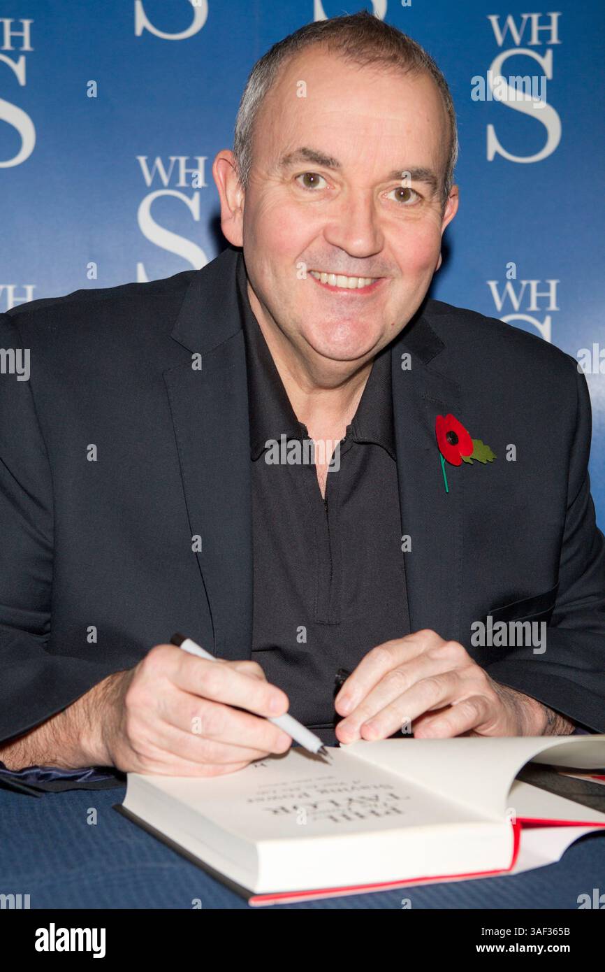 Phil Taylor signs his autobiography at WHSmith Arndale Manchester UK ...