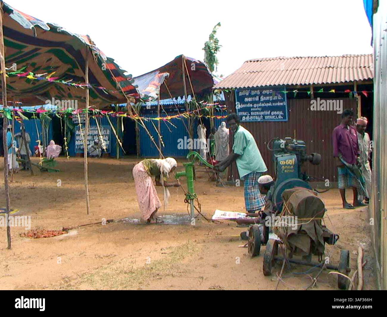 Jan 10, 2005; Nagapattinam, INDIA; A tsunami survivor woman drinks ...