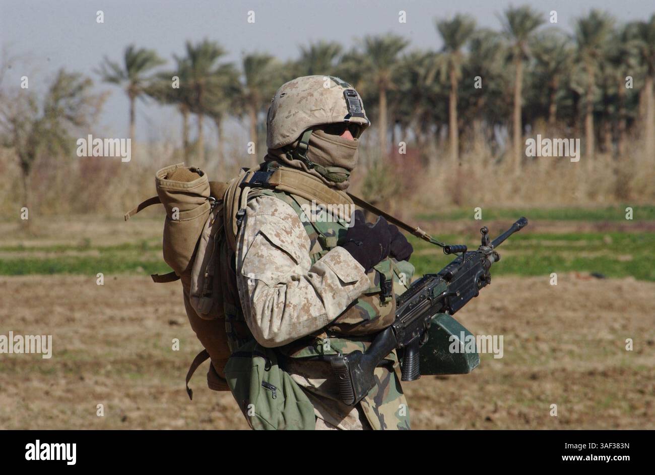 Dec 27, 2004; Ramadi, Iraq; Armed with a Squad Automatic Weapon and ...