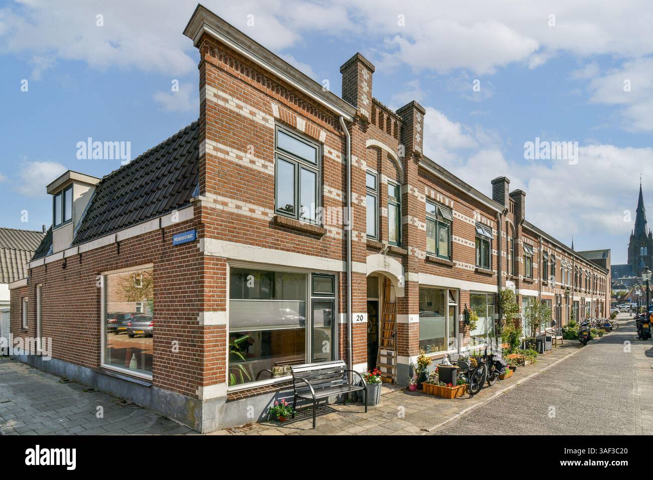 A picturesque street showcasing traditional Dutch buildings with modern ...