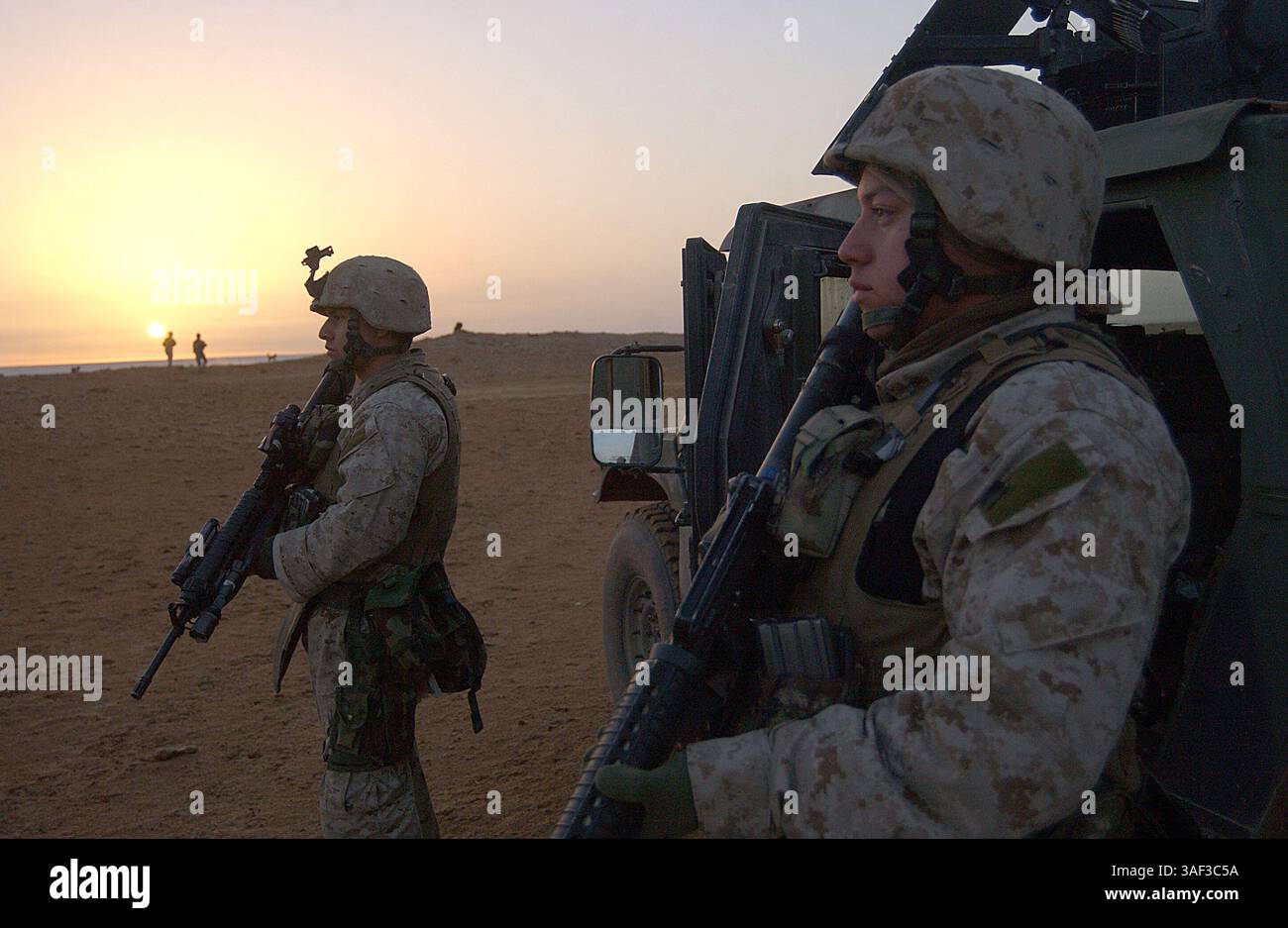 Jan 27, 2005; Karbala, Iraq; Lance Cpl. MARCOS R. SOLTERO, left ...