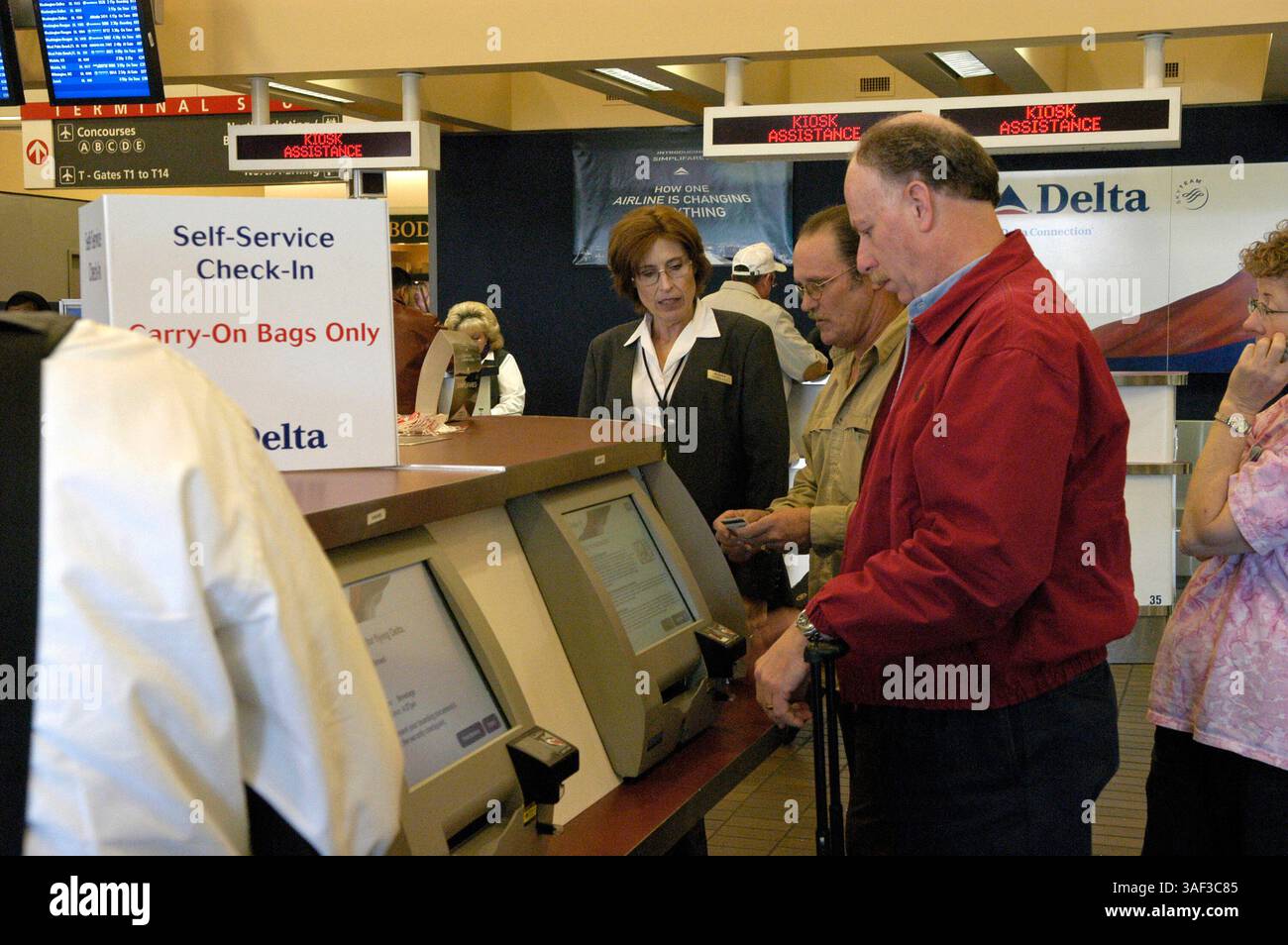 Feb 01, 2005; Atlanta, GA, USA; Delta customer service agent helps ...
