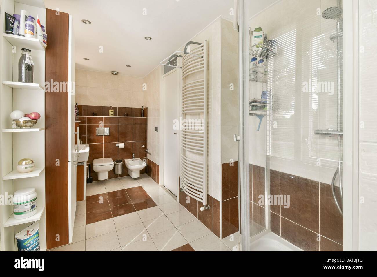 This contemporary bathroom features sleek fixtures, elegant tile work ...