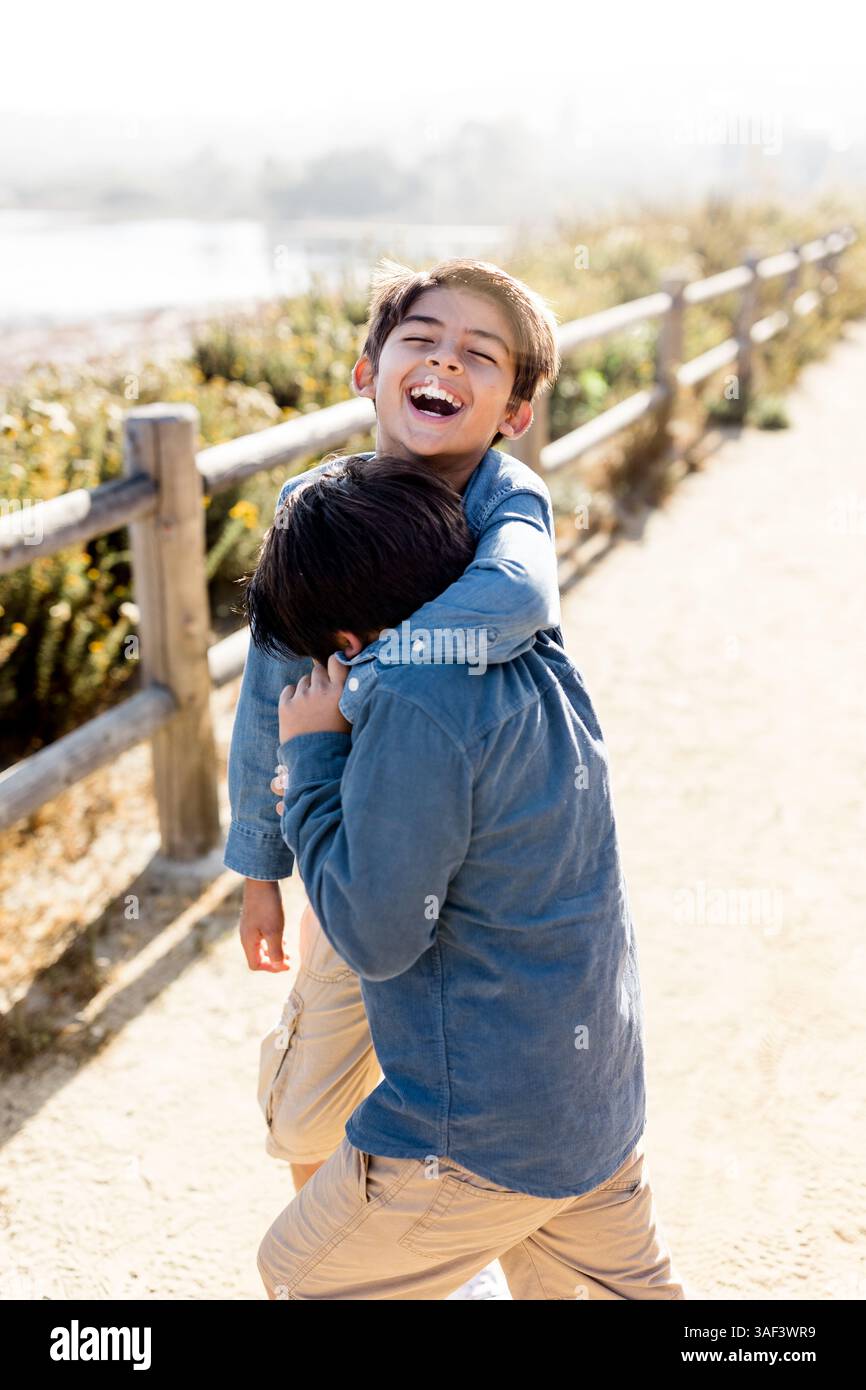 Brothers Laughing & Wrestling Along Trail on Sunny Day in San Diego ...