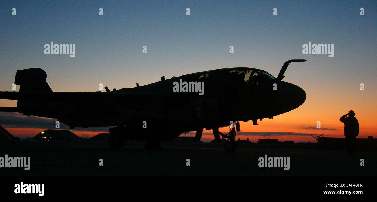 Feb 24, 2005; Al Asad, Iraq; As the Iraqi sun rises, a Marine from ...