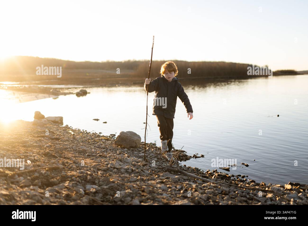 Boy walking along waters hi-res stock photography and images - Alamy