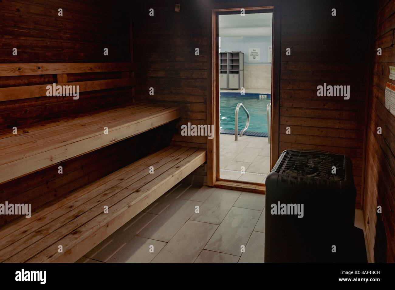 Traditional wooden sauna with electric rocks at hotel pool Stock Photo ...