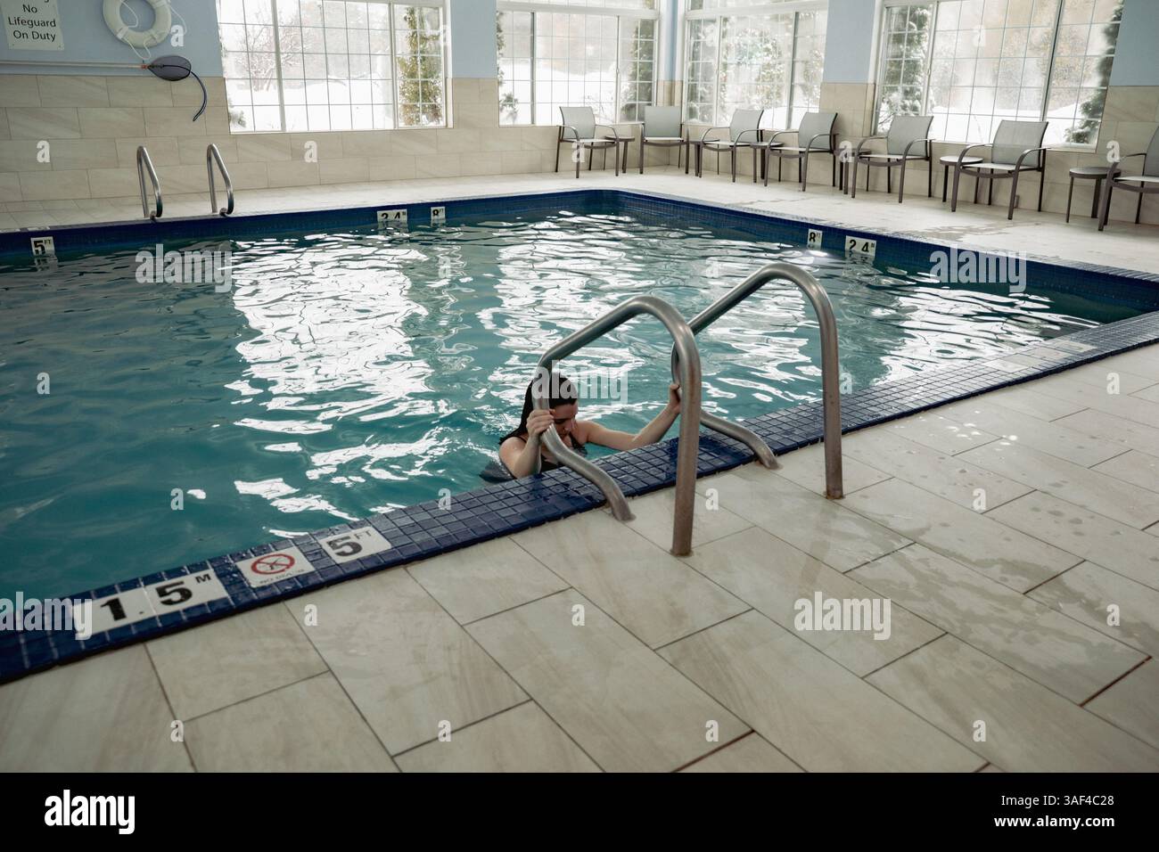 Climbing out of swimming pool hi-res stock photography and images - Alamy
