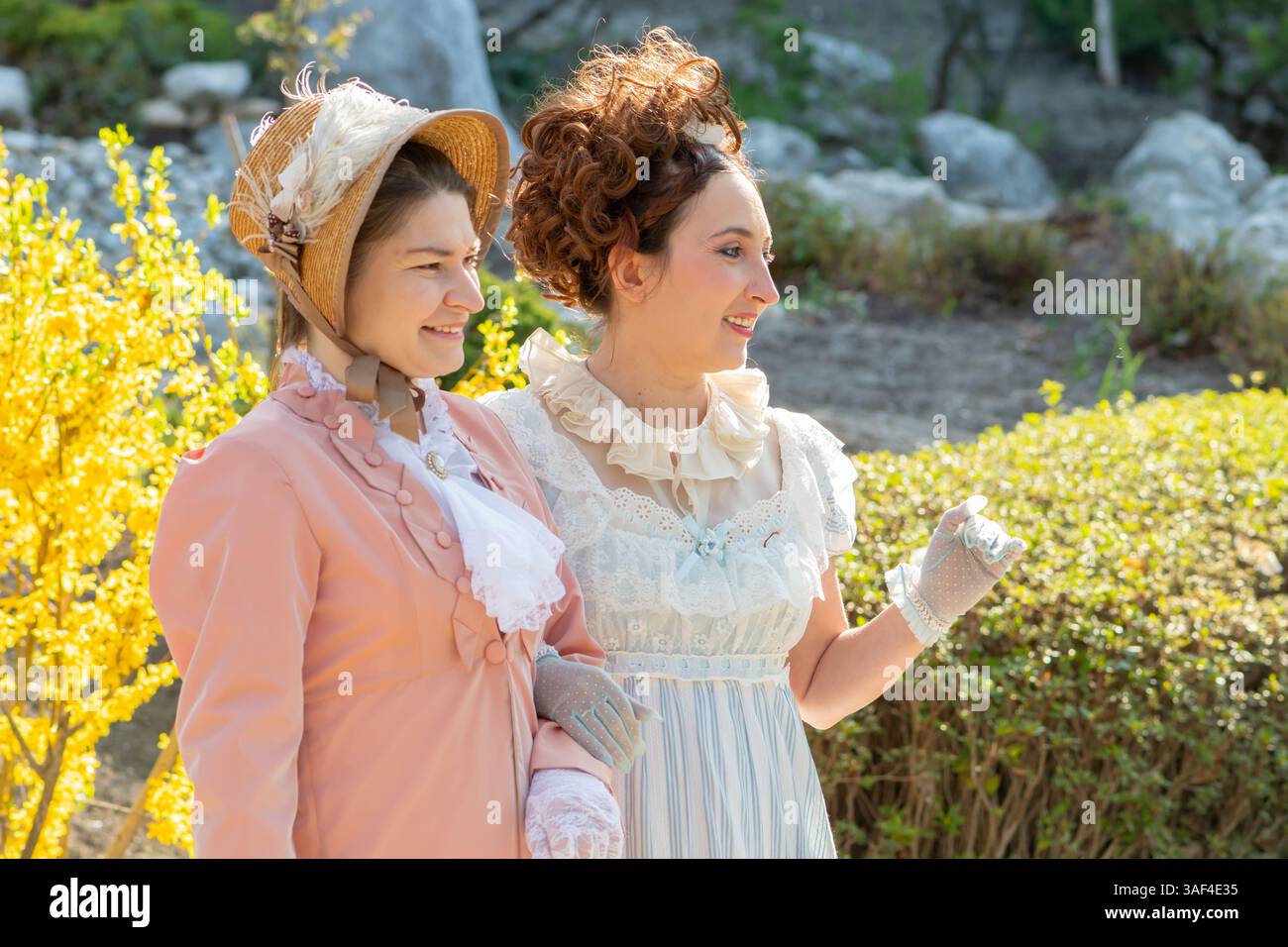 Spring walk of two middle-aged women in 19th century costumes: smiles ...