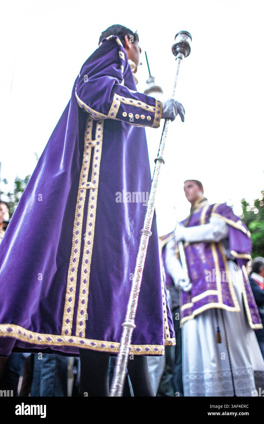 Seville, Spain, Apr 2 2010, Acolytes in purple robes with ceremonial ...