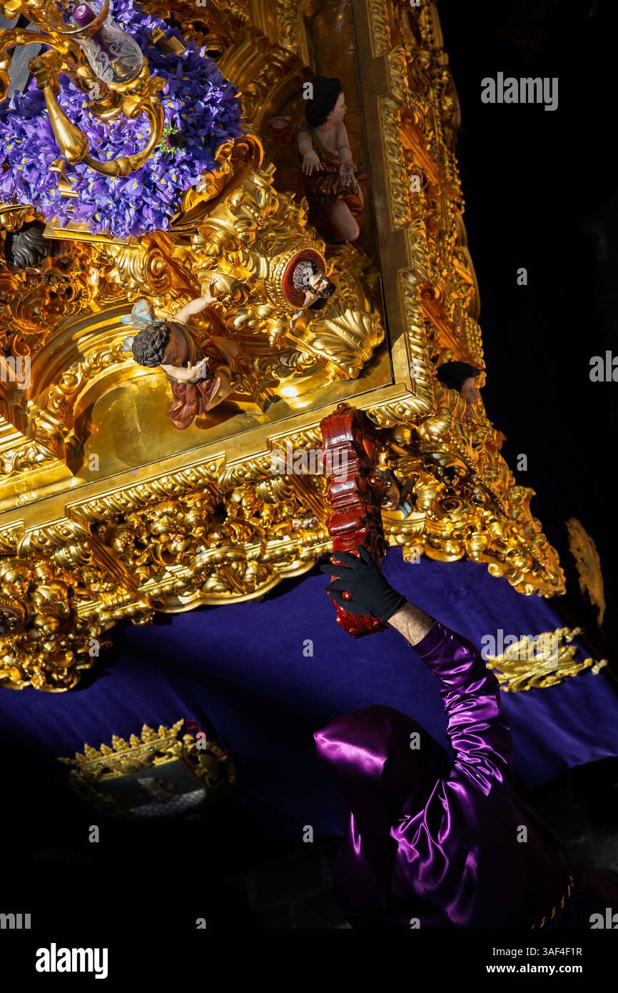 Historical Holy Week celebration featuring a penitent and the ...