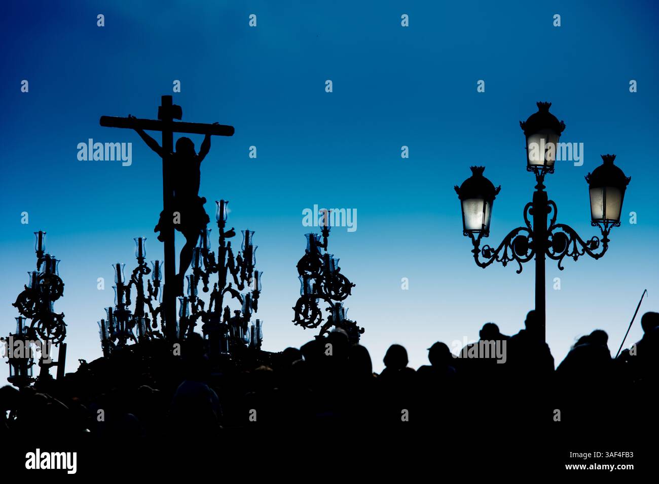 The silhouette of Cristo del Cachorro is seen on his float as it ...