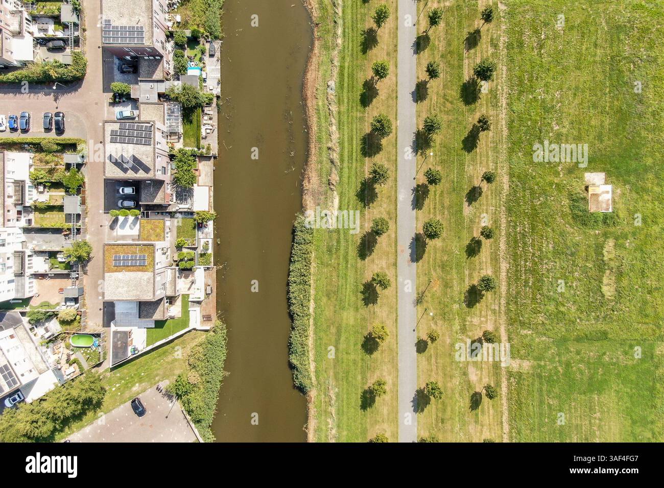 This image showcases an aerial view of a modern urban area adjacent to ...