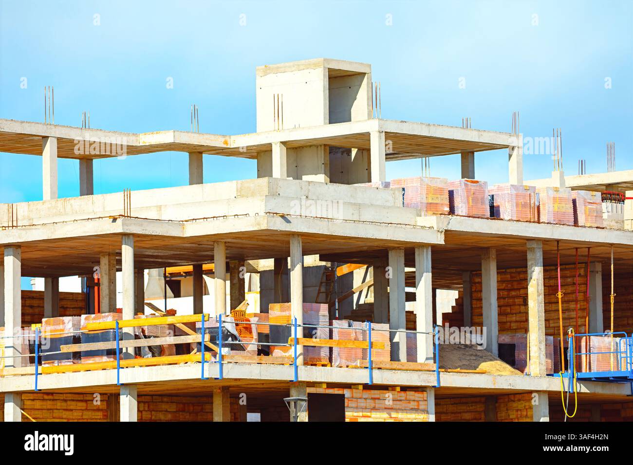 Urban development with multi-story building under construction ...