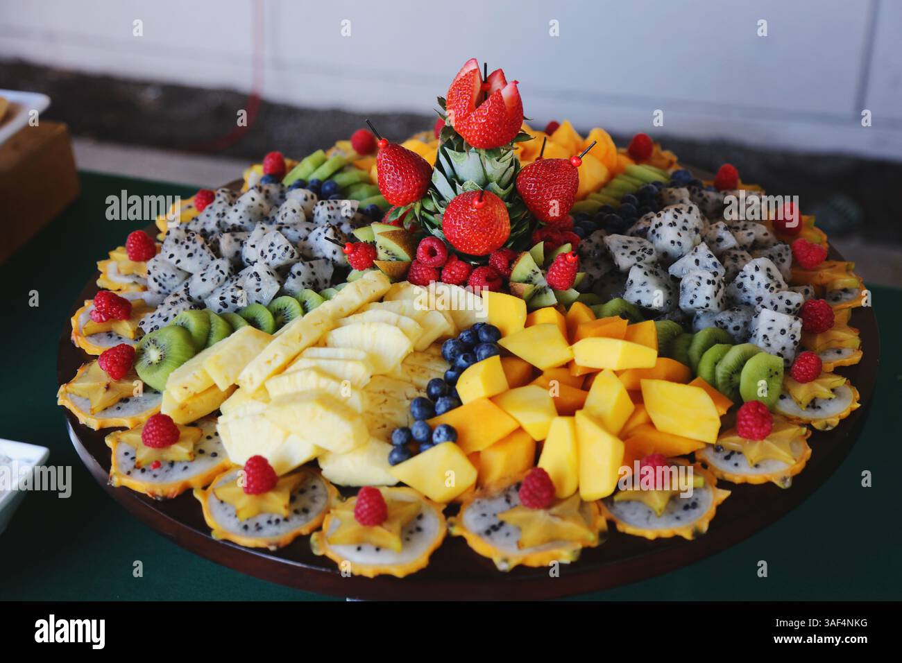 Colorful fruit platter with dragon fruit, mango, kiwi, and berries ...