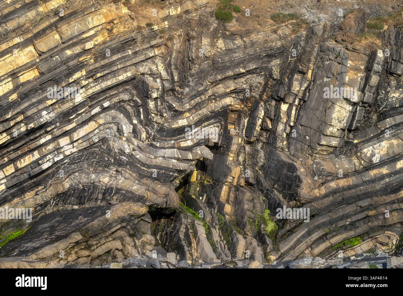 This stunning image showcases unique wavy patterns in rock strata ...