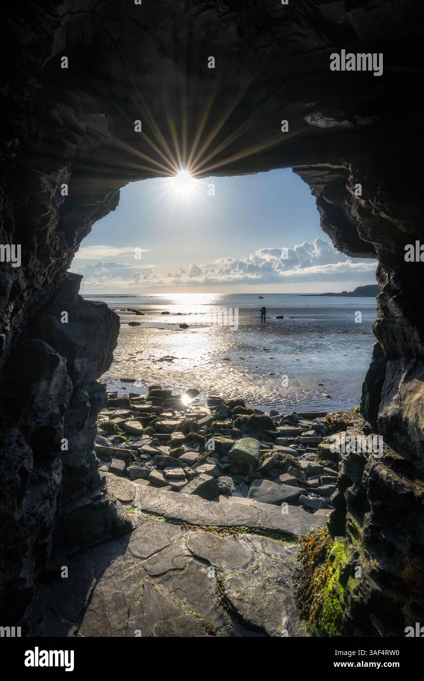 From a breathtaking coastal cave, one can witness a stunning view ...