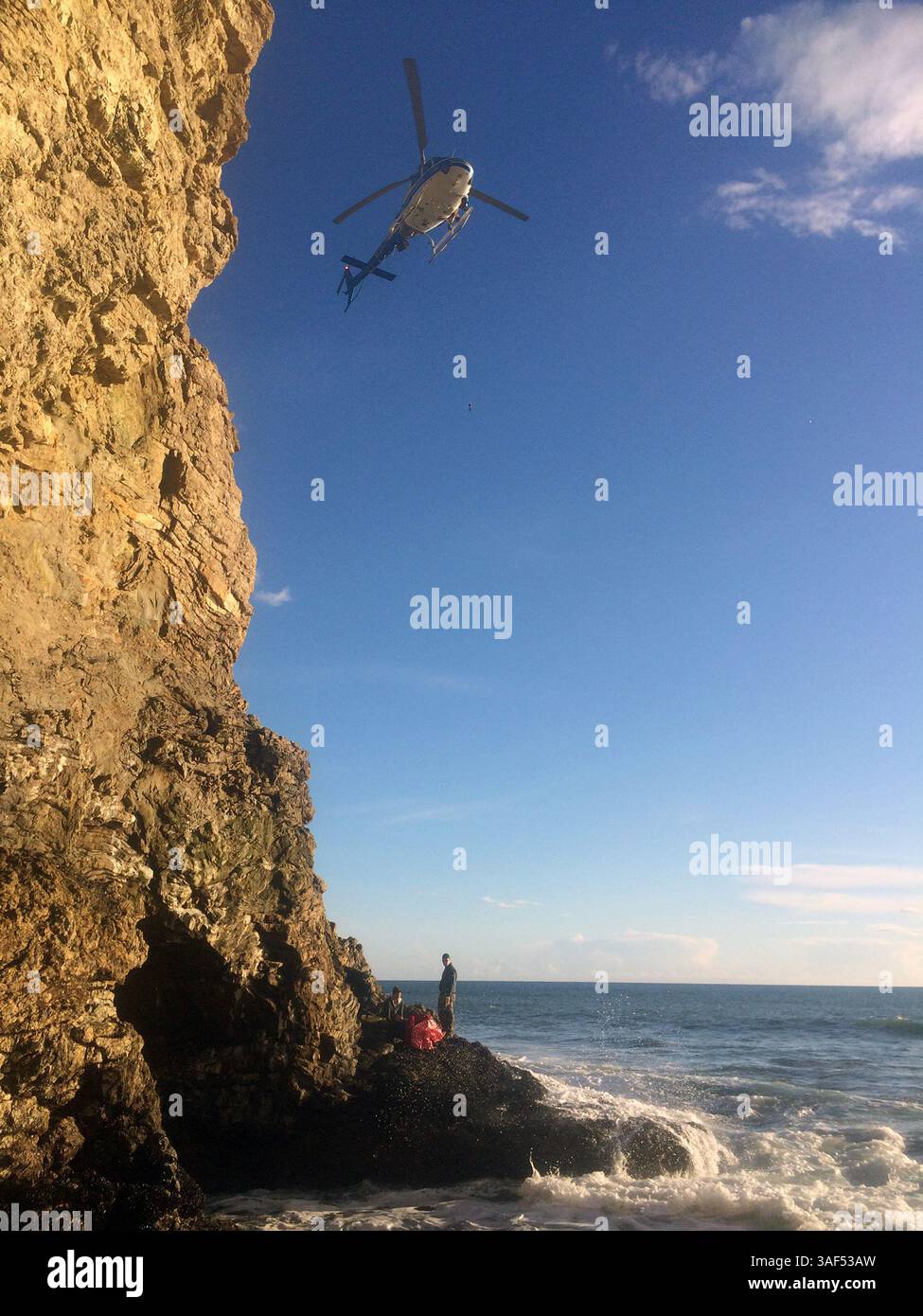 Helicopter arrives airlift man hi-res stock photography and images - Alamy