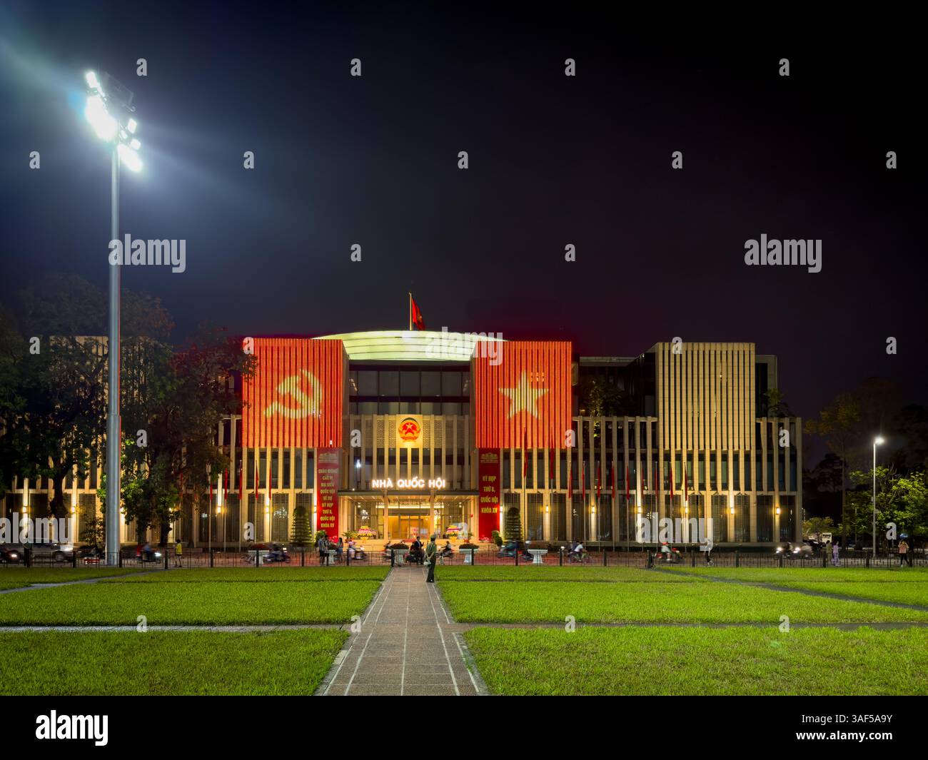 The Vietnam National Assembly building at night with an illuminated ...