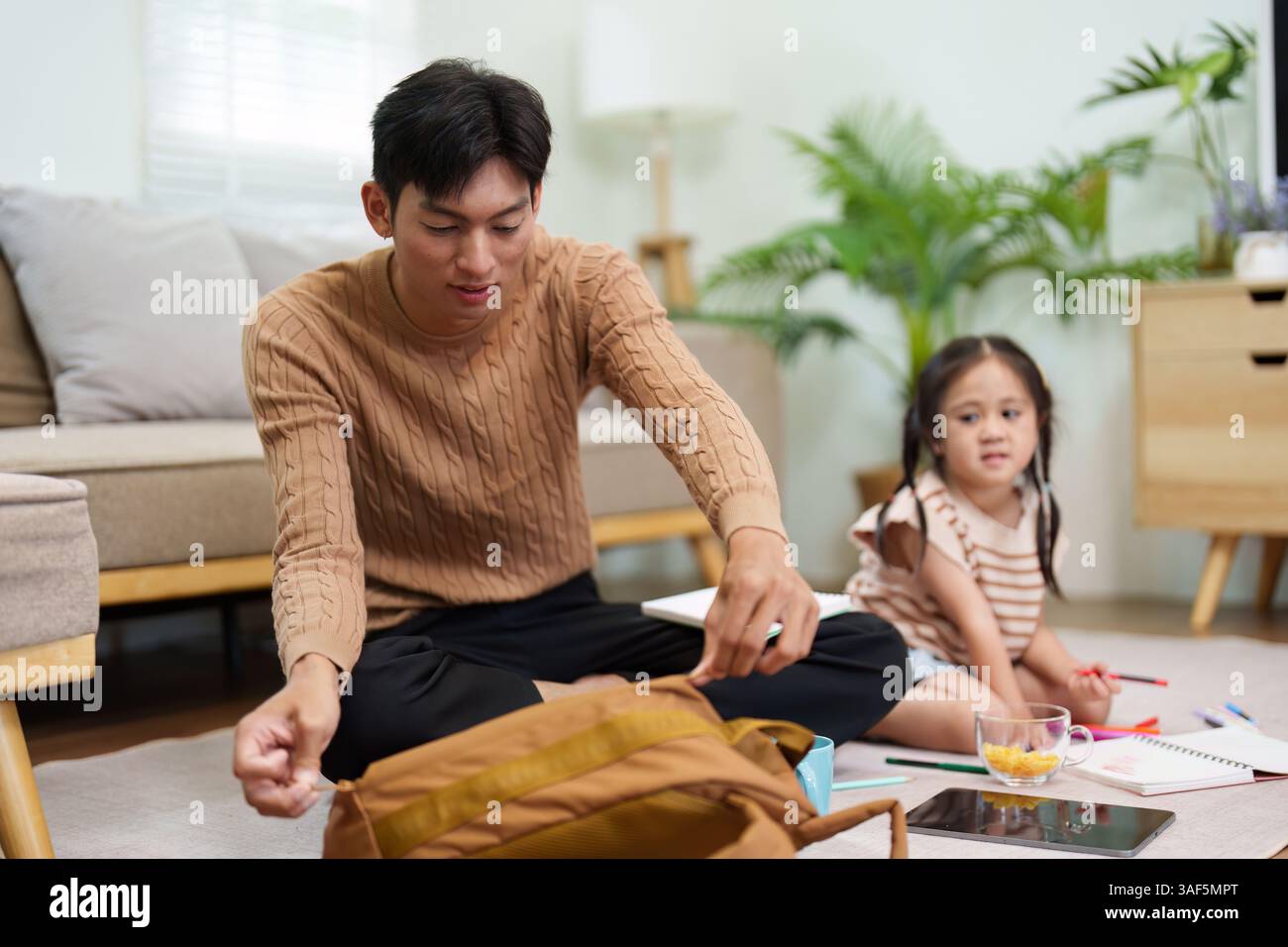 Back to School and Family Bonding. A father prepares his daughter for ...