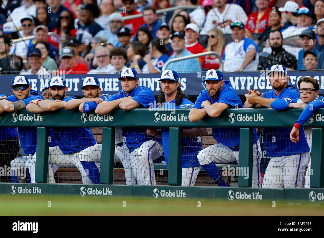 ATLANTA, GA - APRIL 05: Braves pitchers watch from the top rail of the ...
