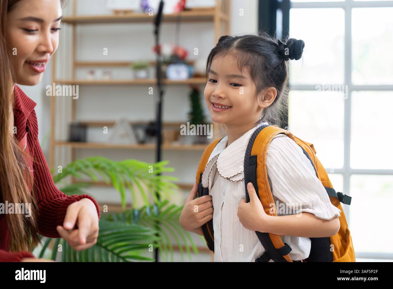 Back to School and Parent-Child Interaction. A child excitedly prepares ...
