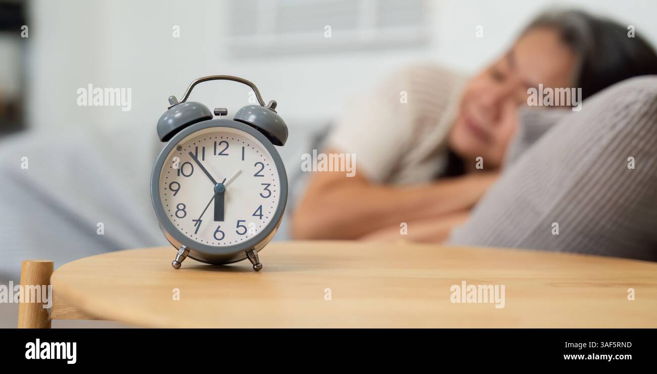 Sleep Routine and Wellness. An alarm clock signals time for rest in an ...