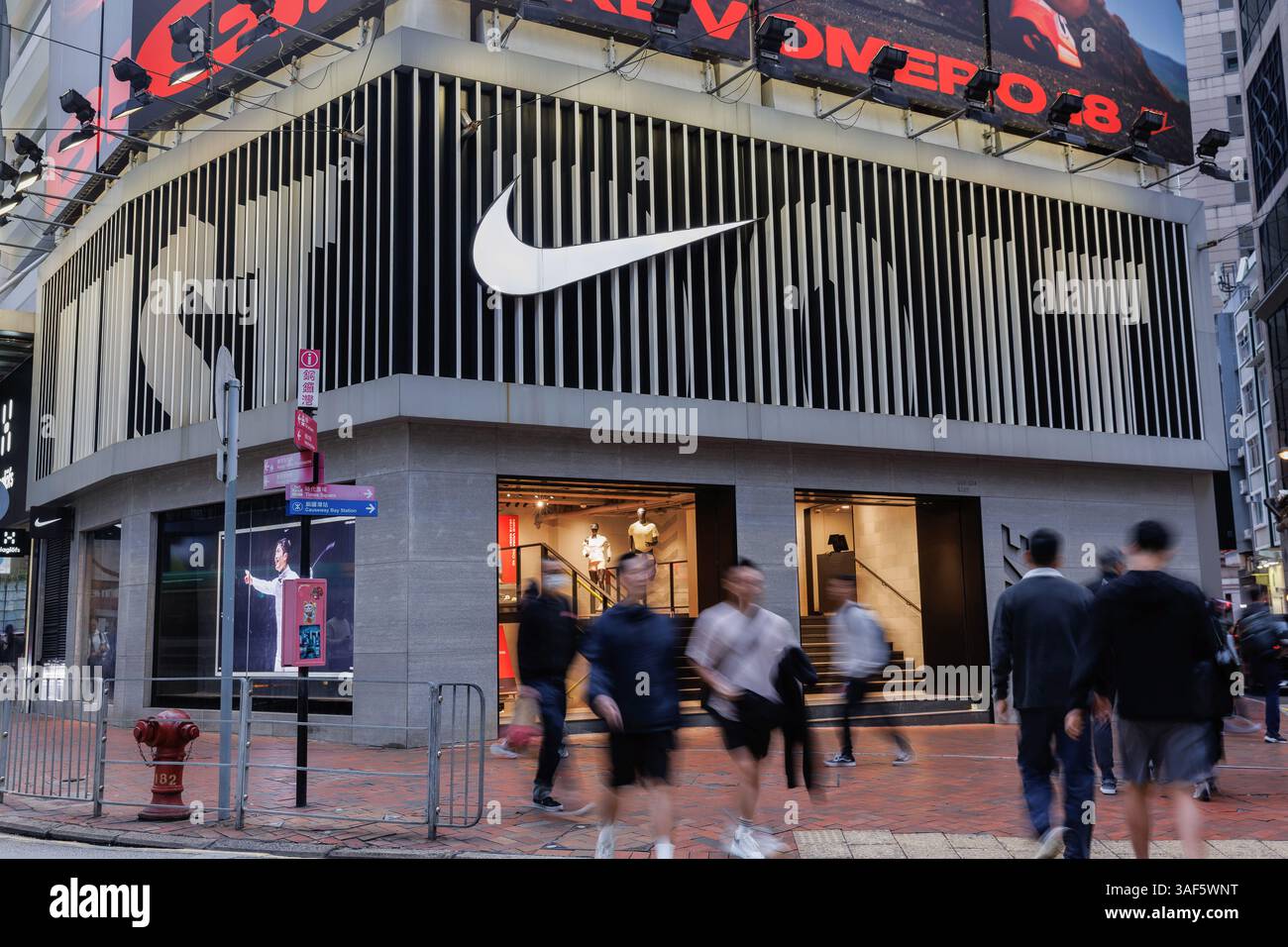 People walk pass Nike’s store in Hong Kong. Nike, one of the world’s ...