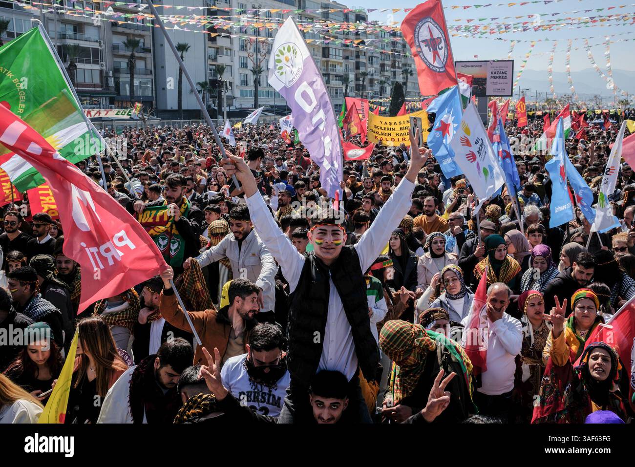 Izmir, Turkey. 22nd Mar, 2025. A young man makes a victory sign during the celebrations. (Credit ...