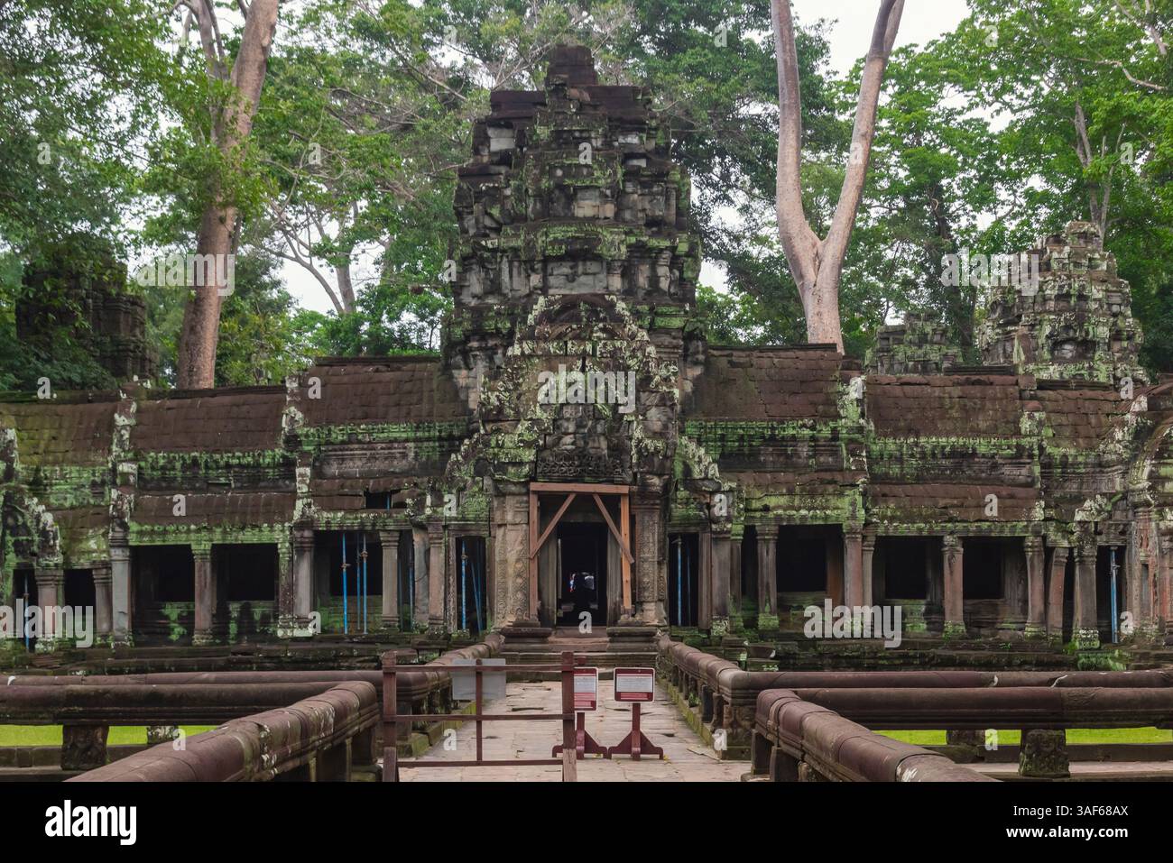 Moss-covered green stone building structure exterior and bricks at Ta ...