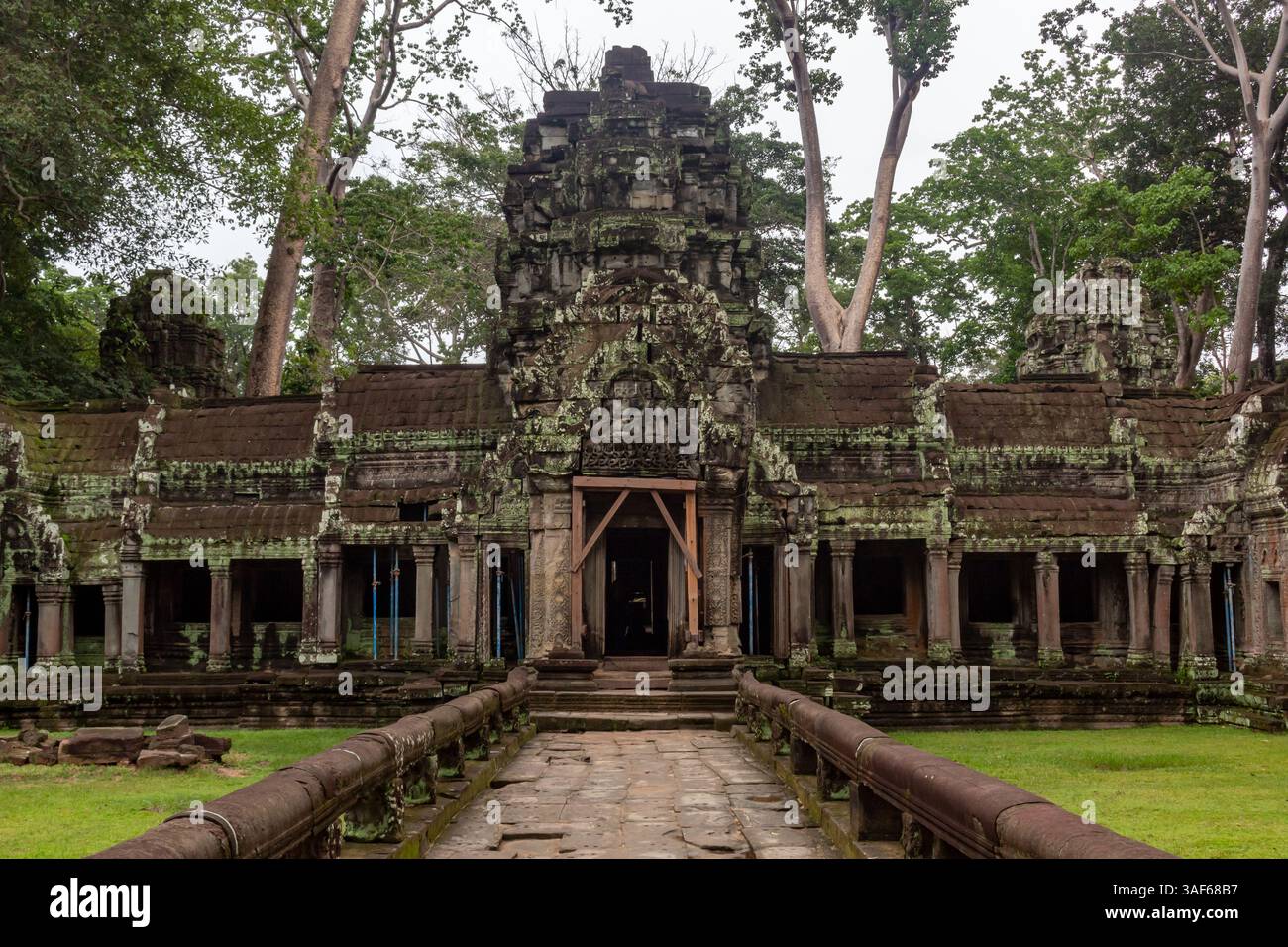 Moss-covered green stone building structure exterior and bricks at Ta ...
